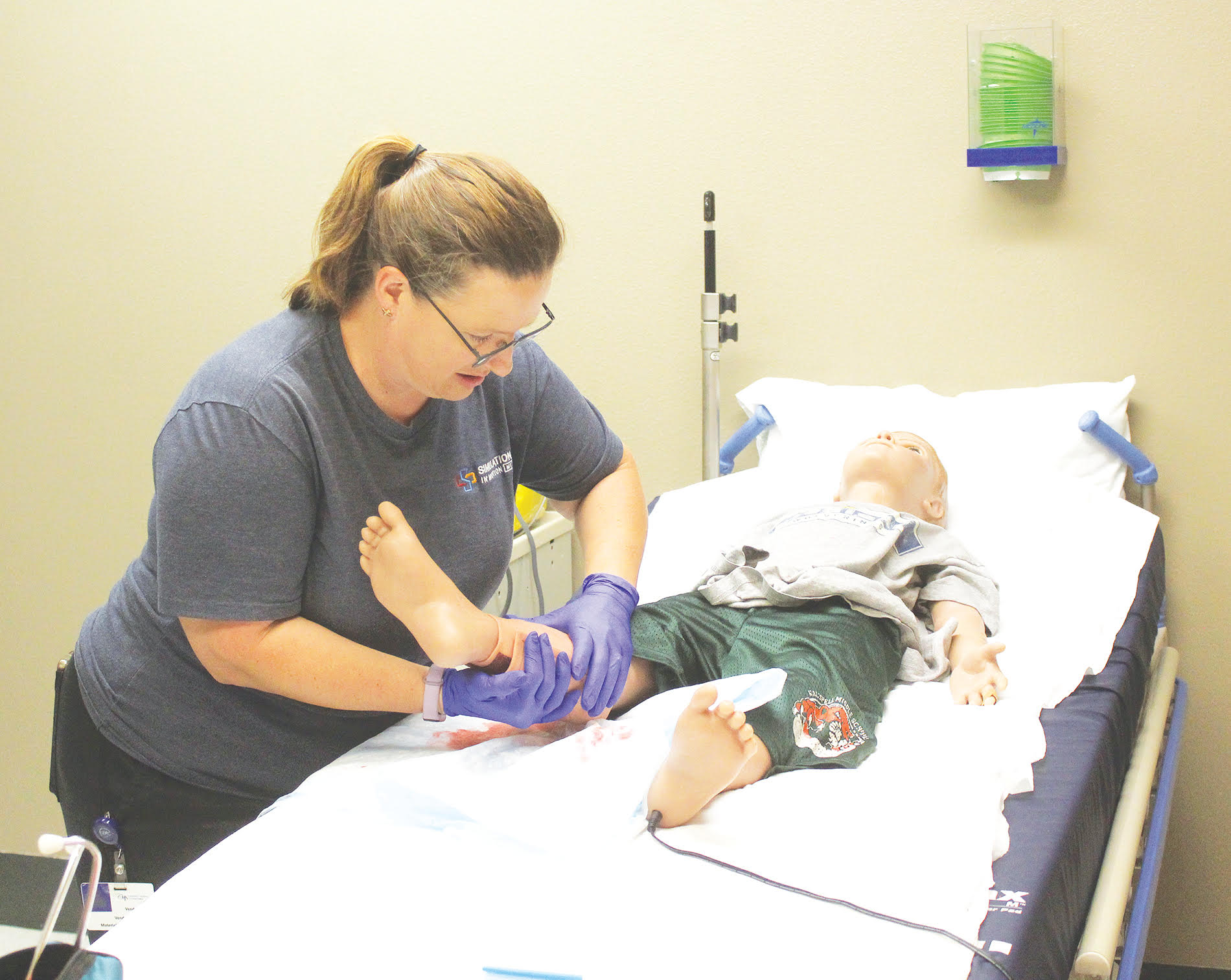 Local medical professionals participate in pediatric trauma simulation